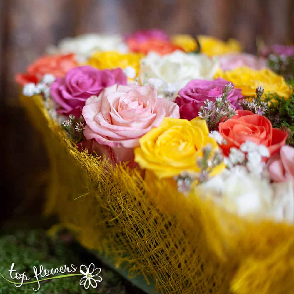 Splendor is a heart of colorful roses, arranged with love.