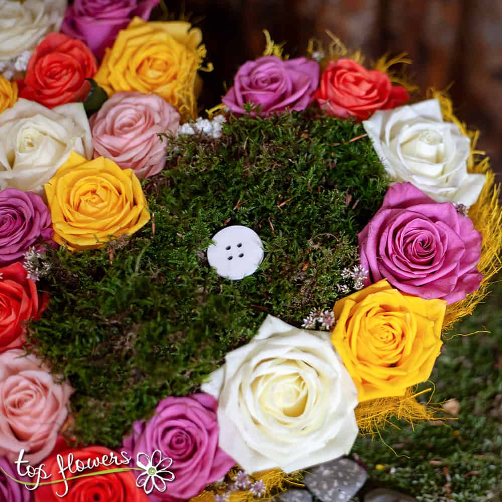 Splendor is a heart of colorful roses, arranged with love.